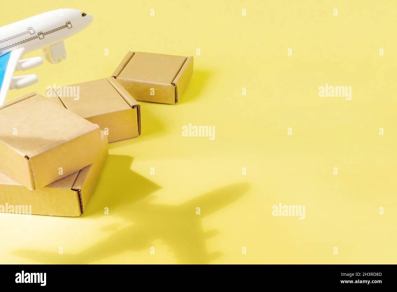 Shadow Airplane and stack of cardboard boxes. concept of air cargo and ...