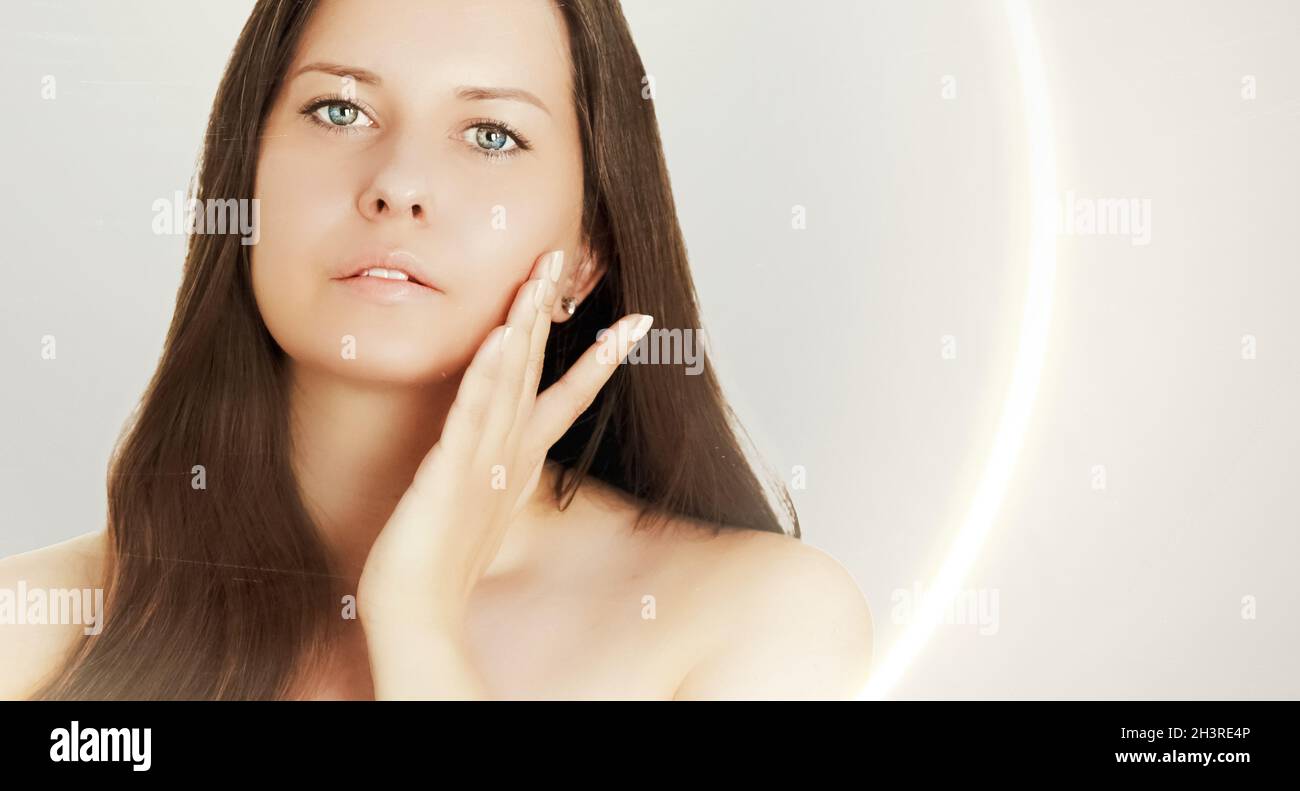 Suntan skin tone and beauty routine. Beautiful brunette female model ...