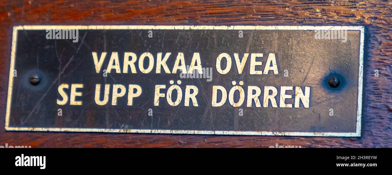 Door warning sign on board of vintage tram on display at the Tram ...