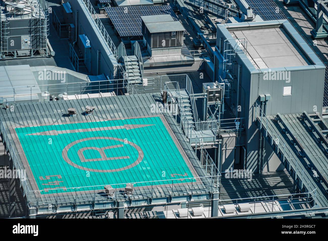 The roof of the machine room and the heliport of the high-rise building ...