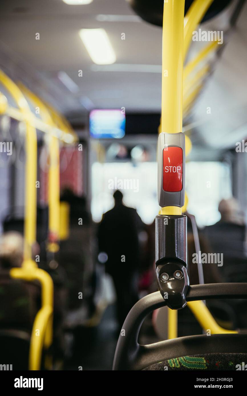Red stop button in a bus, commuting, public transport Stock Photo - Alamy