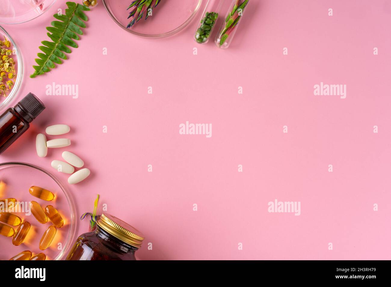 Herbs and Herbal dietary supplements top view on pink background Stock ...