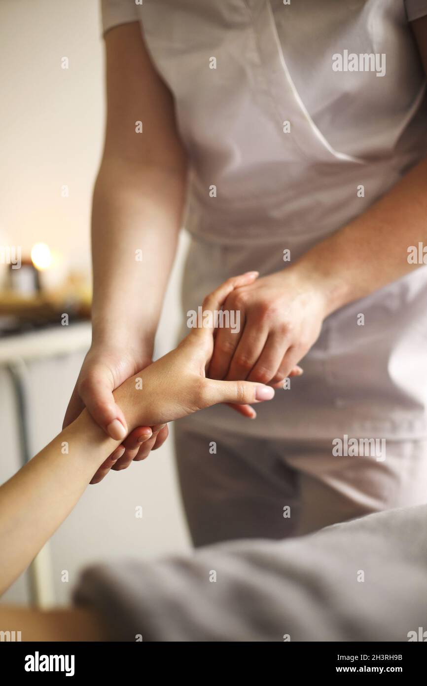 Woman masseur giving massage to client Stock Photo - Alamy