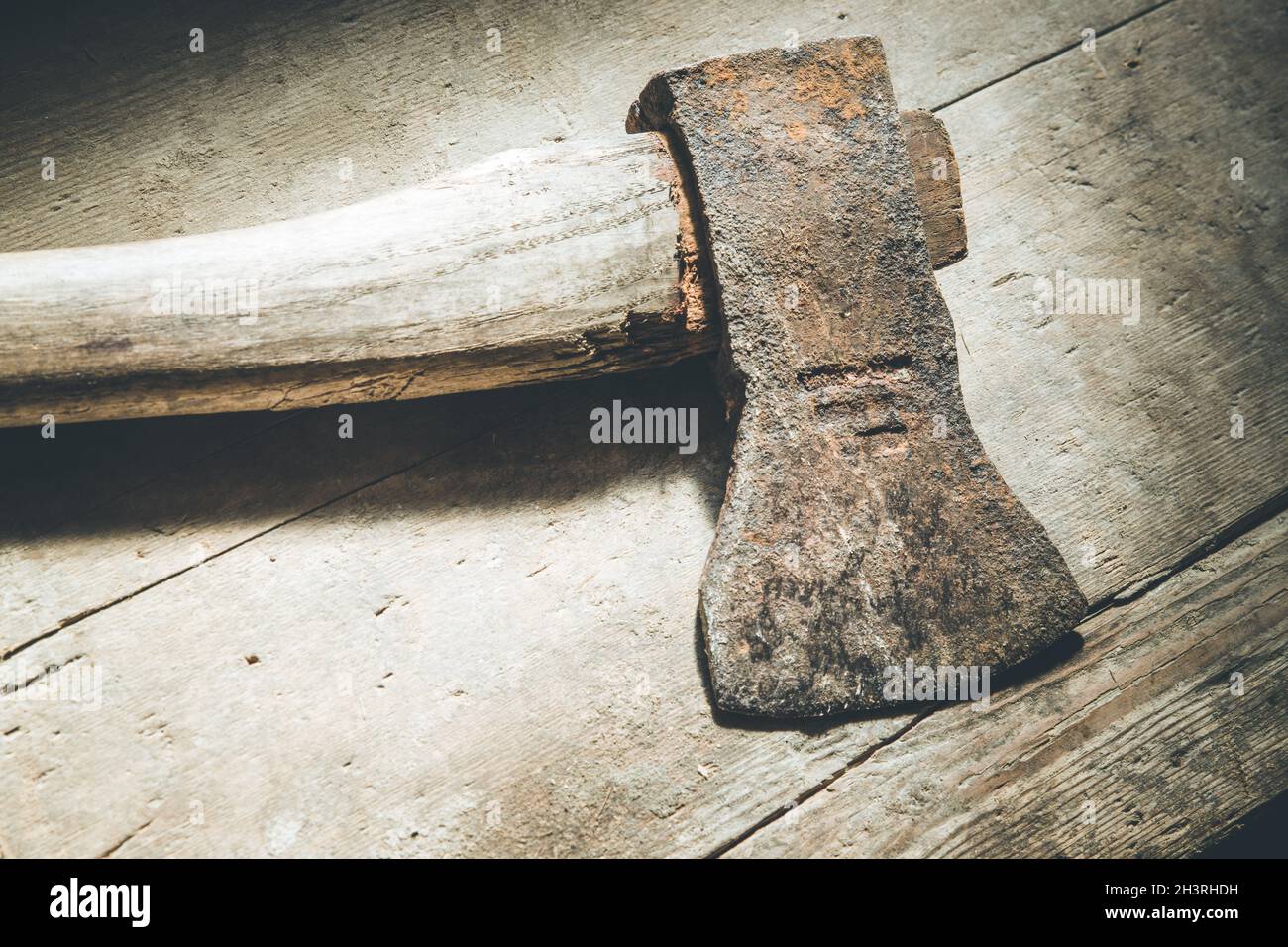 Old rusty axe is lying on rustic wooden floor Stock Photo - Alamy