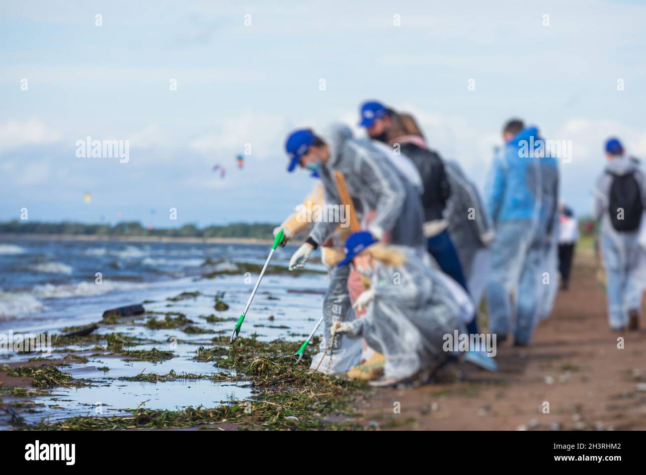 Process of cleaning up the shore beach line from litter garbage rubbish ...