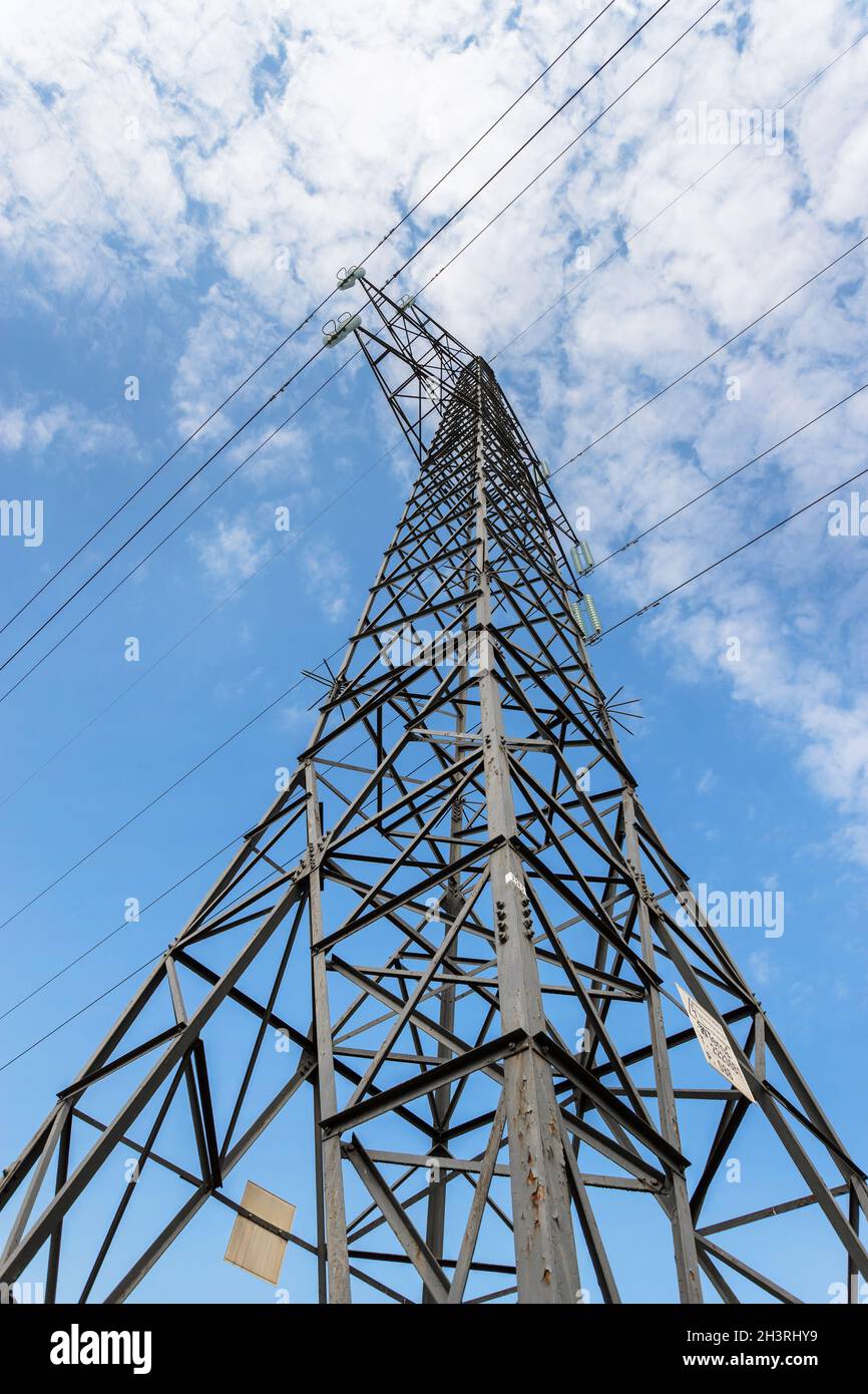 Power transmission tower against the sky. Bottom view. Electricity for ...