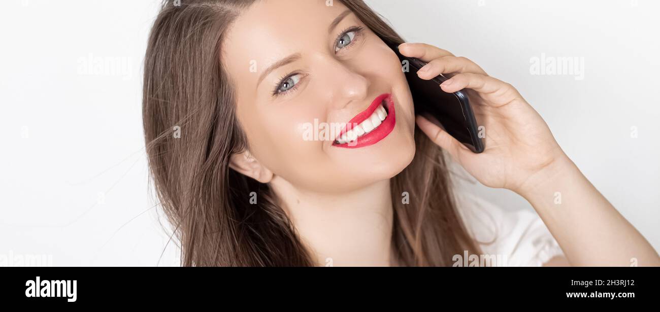 Happy smiling woman calling on smartphone, portrait on white background ...