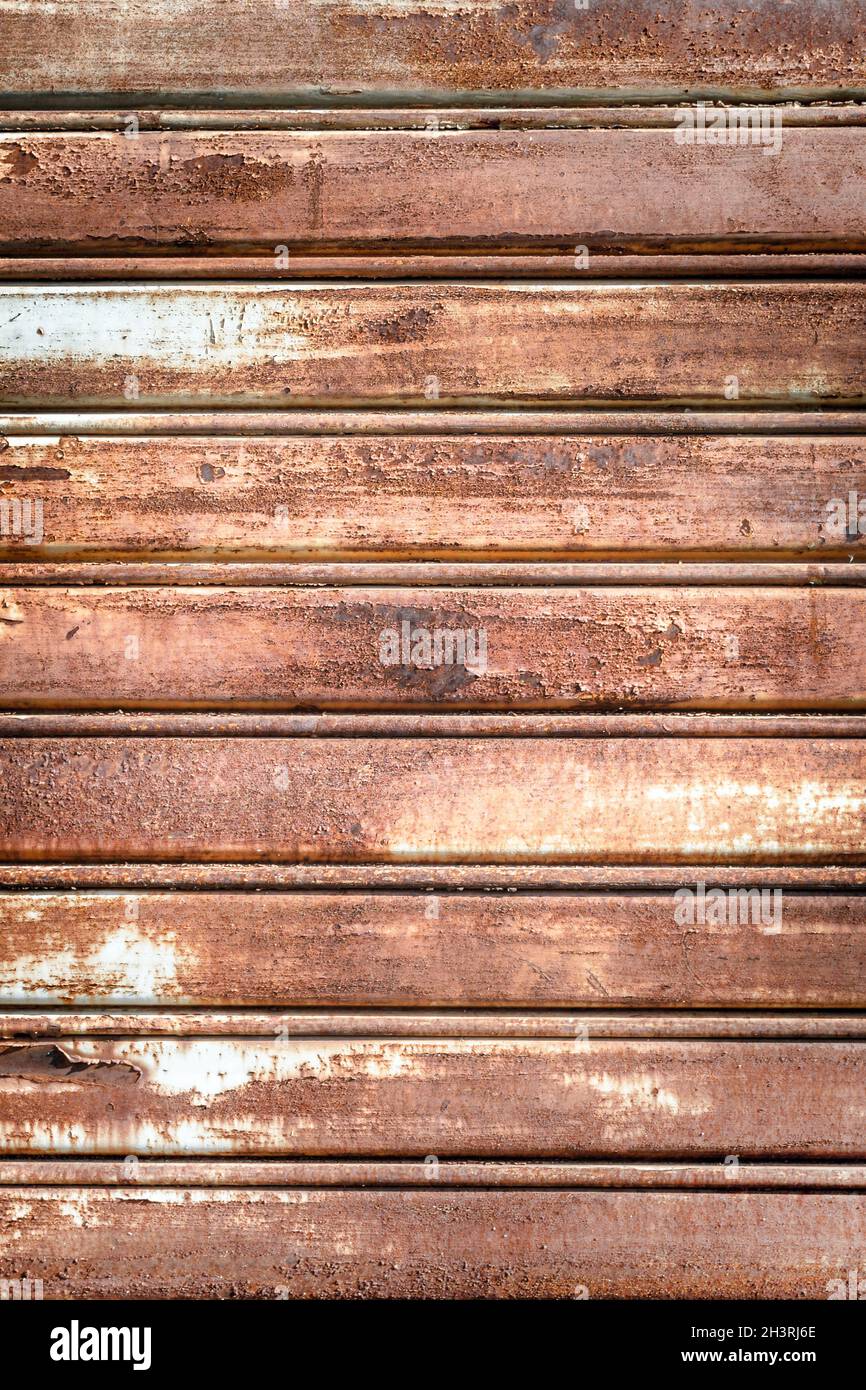 Metal shutter with peeling paint. Front view of a shutter rusted ...