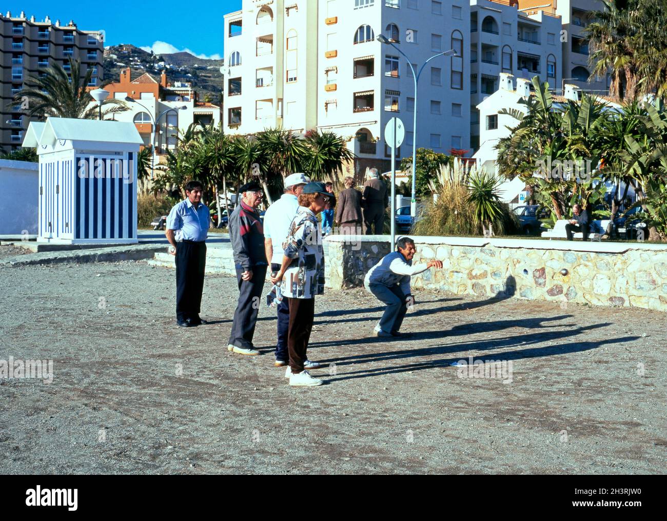 People playing ball game on beach (Petanque), Almunecar, Spain Stock ...