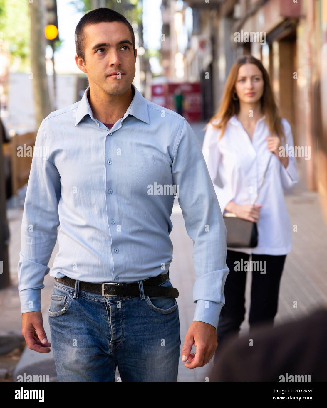 Man walking through the streets hi-res stock photography and images - Alamy