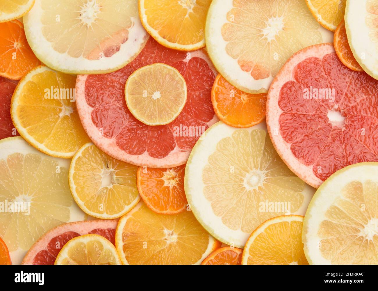 Citrus fruits cut into round pieces: orange, grapefruit, lemon ...
