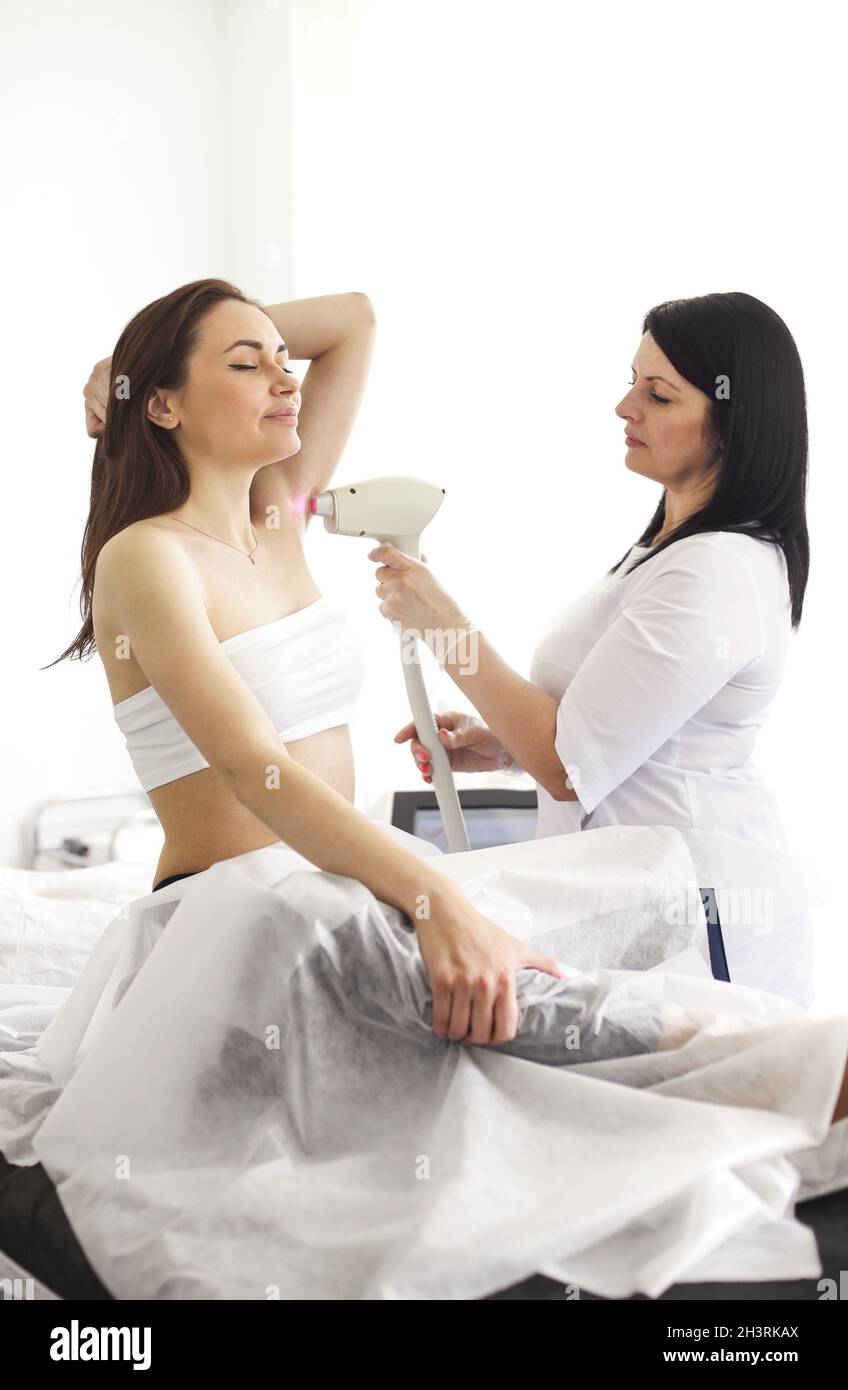Woman on procedure of laser epilation Stock Photo - Alamy