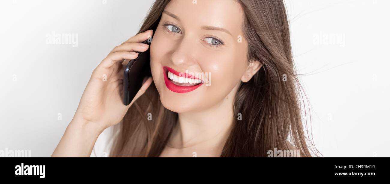 Happy smiling woman calling on smartphone, portrait on white background ...