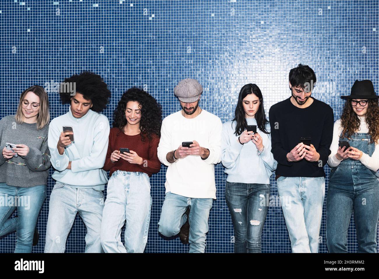 Young people using mobile smartphone in subway train station - Youth ...