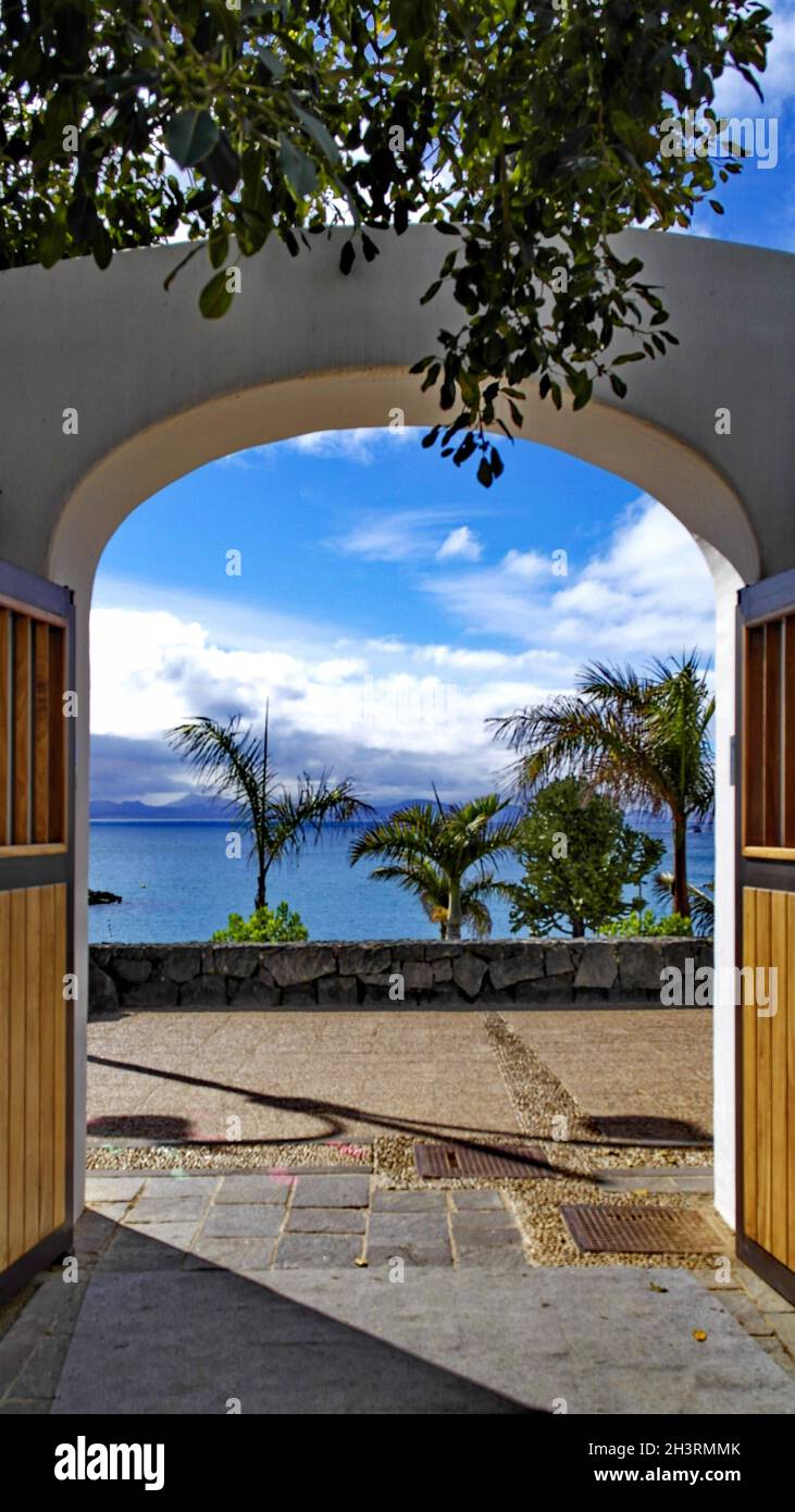 Arch gate with a view of the seascape Stock Photo - Alamy