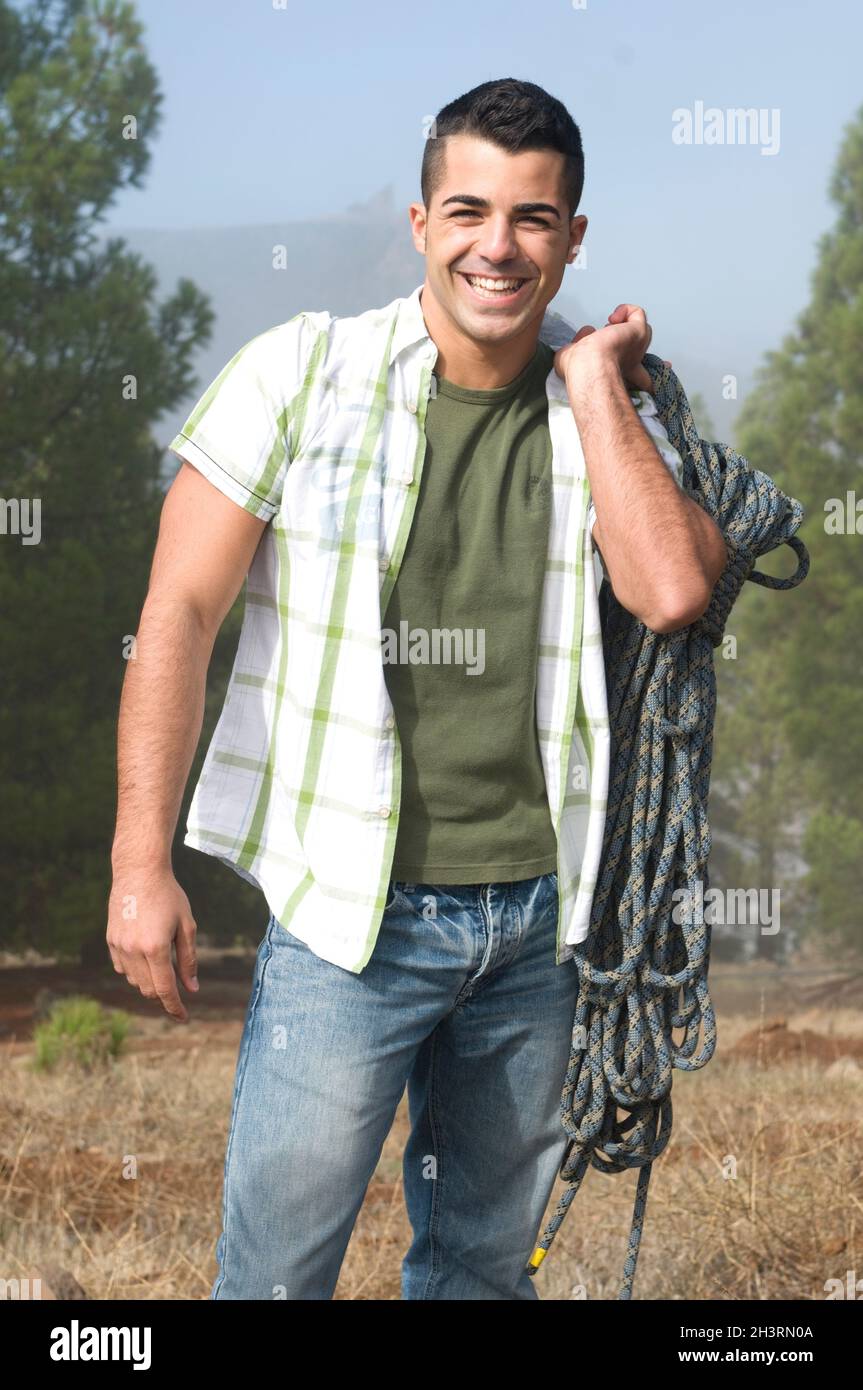 climber man with his rope in the mountain Stock Photo - Alamy
