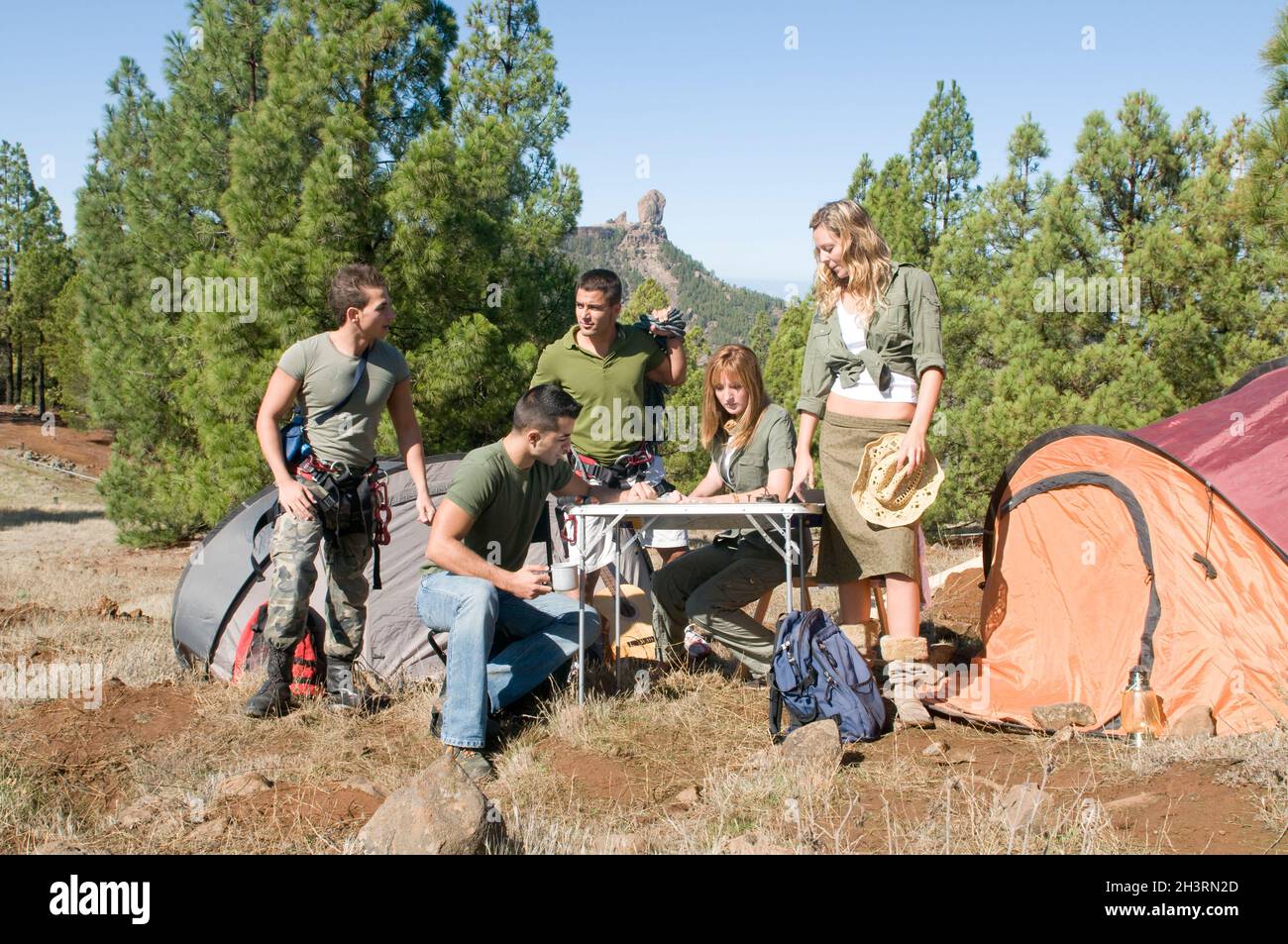group of friends having fun on a camping trip Stock Photo - Alamy