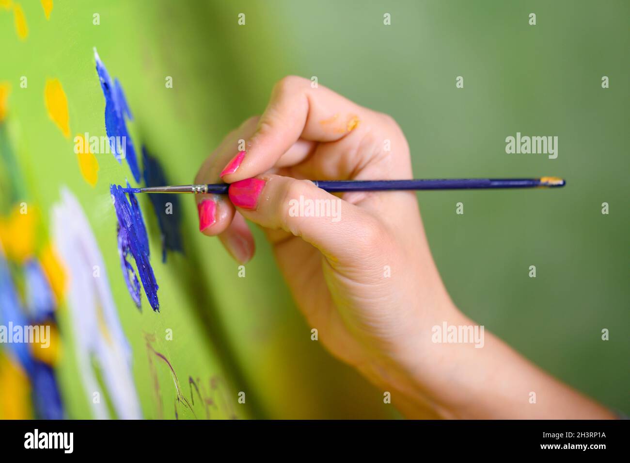 Close-up Shot of Female Artist Hand, Holding Paint Brush and Drawing ...