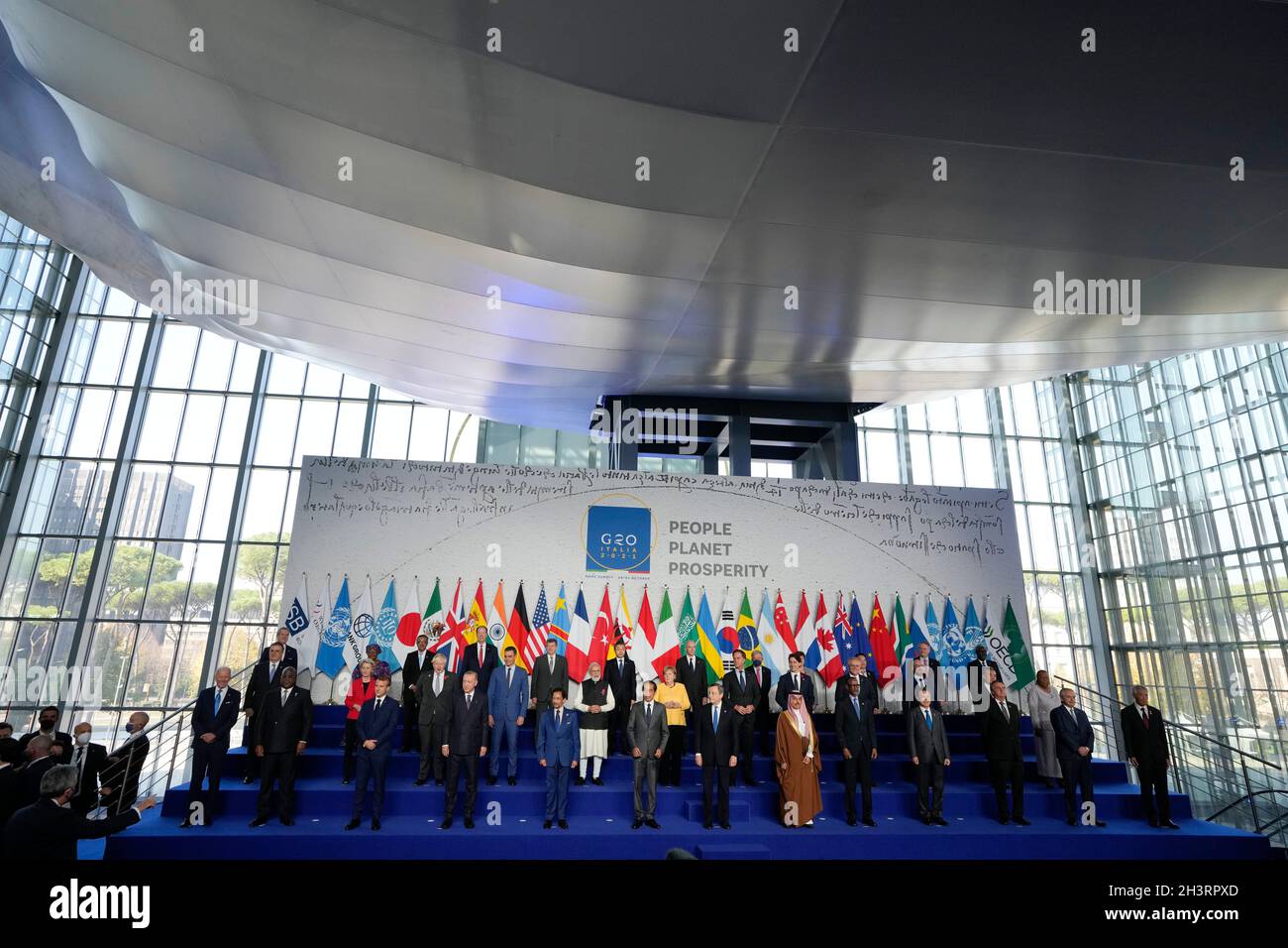 World leaders pose for a group photo at the La Nuvola conference center ...
