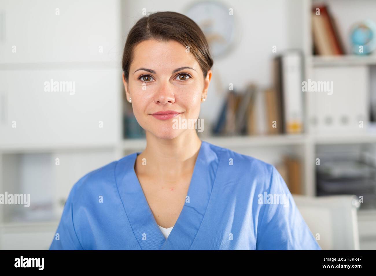 Smiling adult doctor assistant hi-res stock photography and images - Alamy