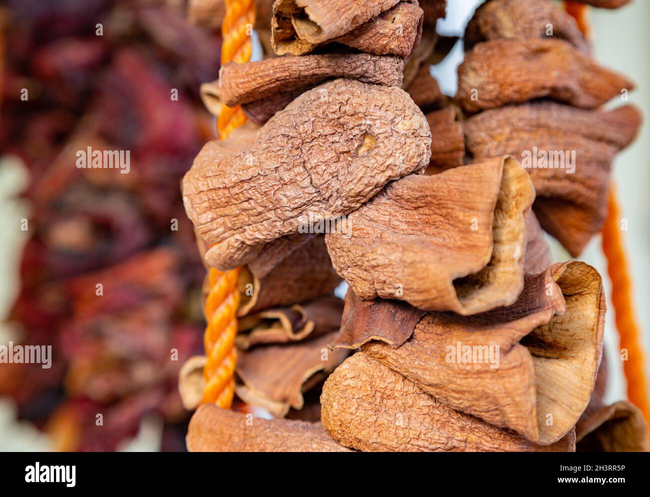 Dried vegetables close-up. Sun-dried eggplants hung on strings Stock ...