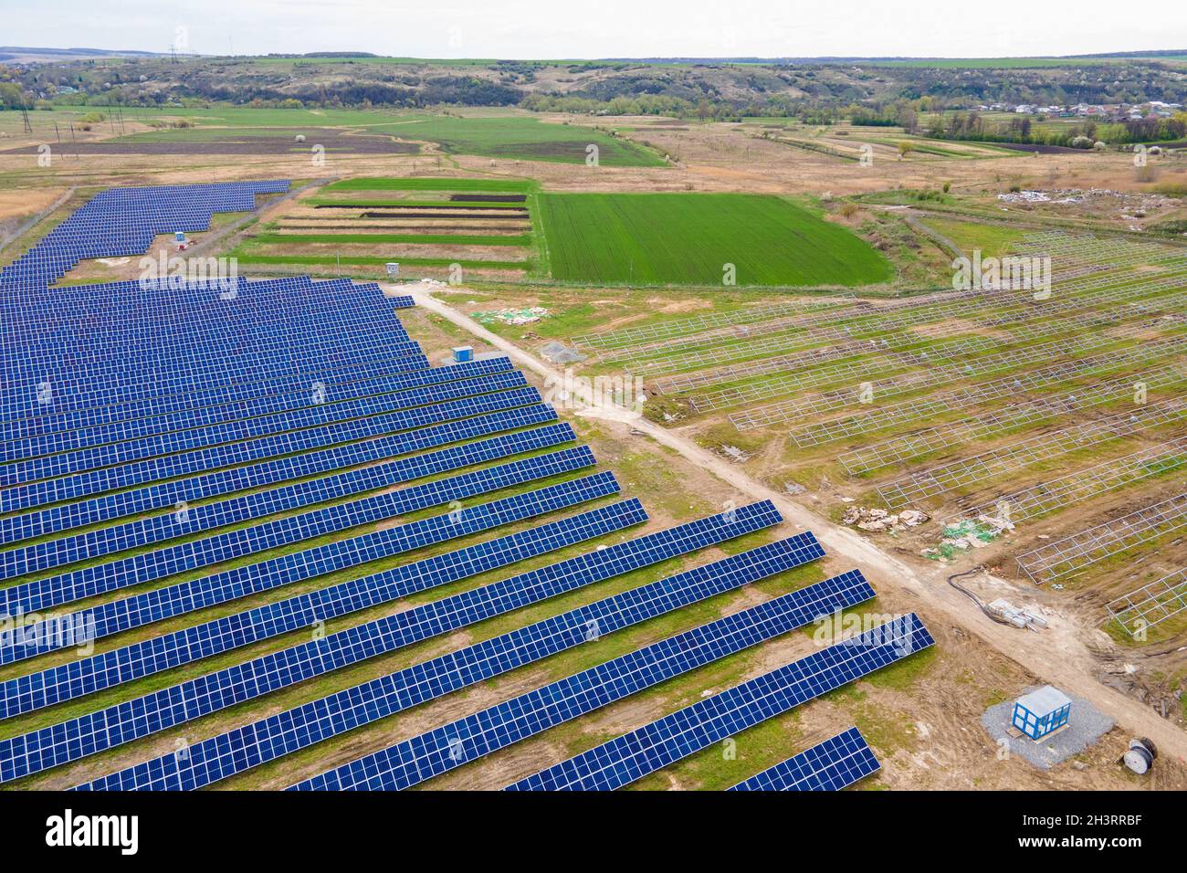 Aerial view of big electric power plant construction with many rows of ...