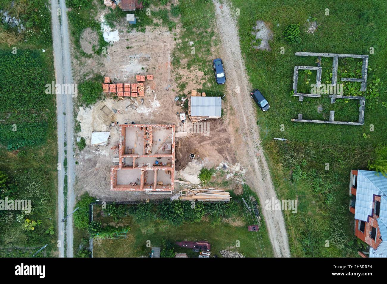 Top down aerial view of building works of new house concrete foundation ...