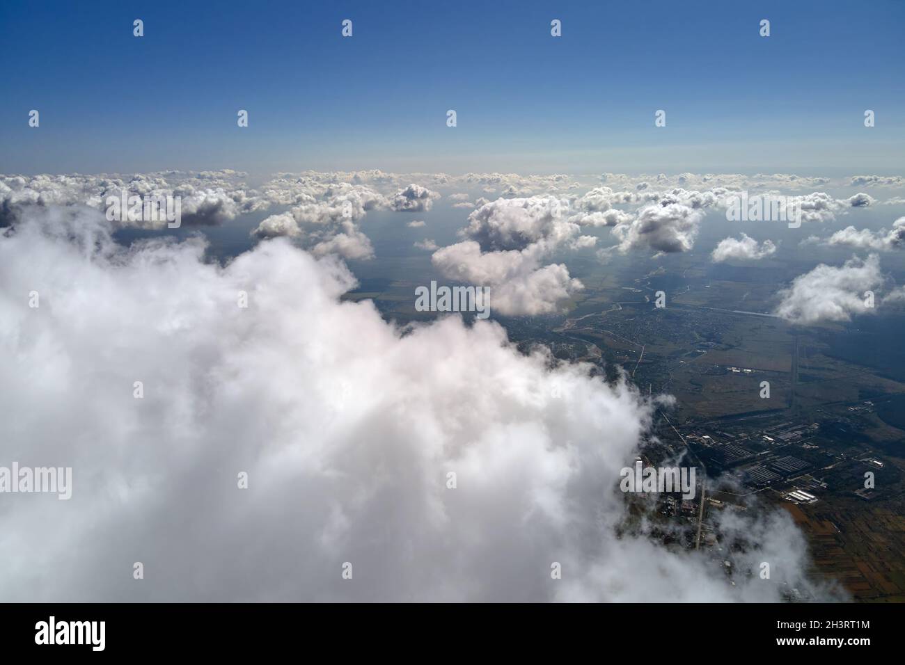 Aerial view from airplane window at high altitude of earth covered with ...