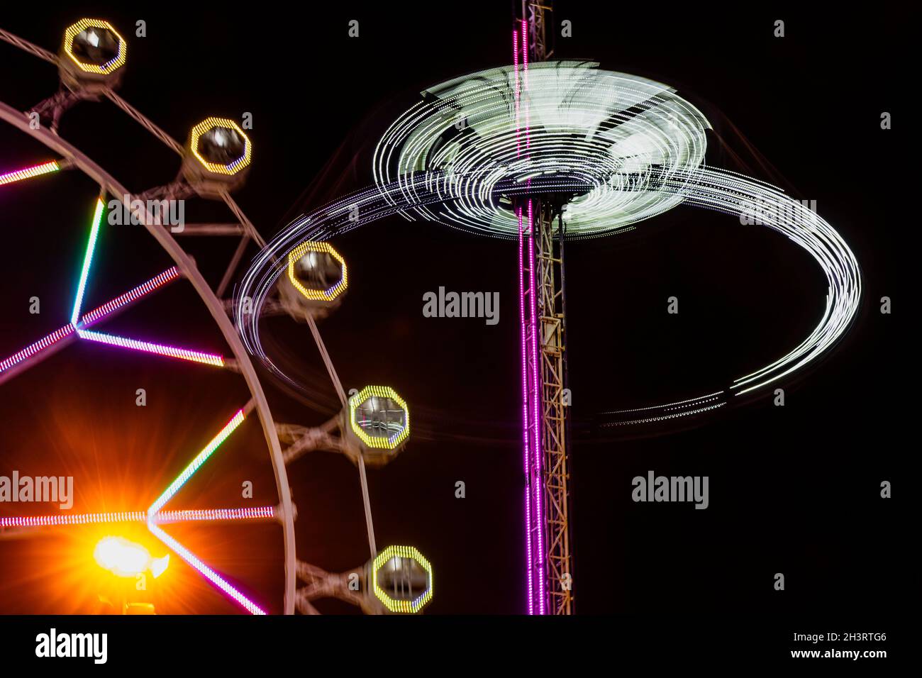 Spinning chair ride at a fairground in Girona, Spain Stock Photo - Alamy