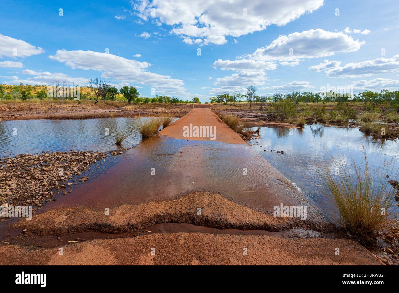 Flooded creek crossing on the remote Buchanan Highway, named after the ...
