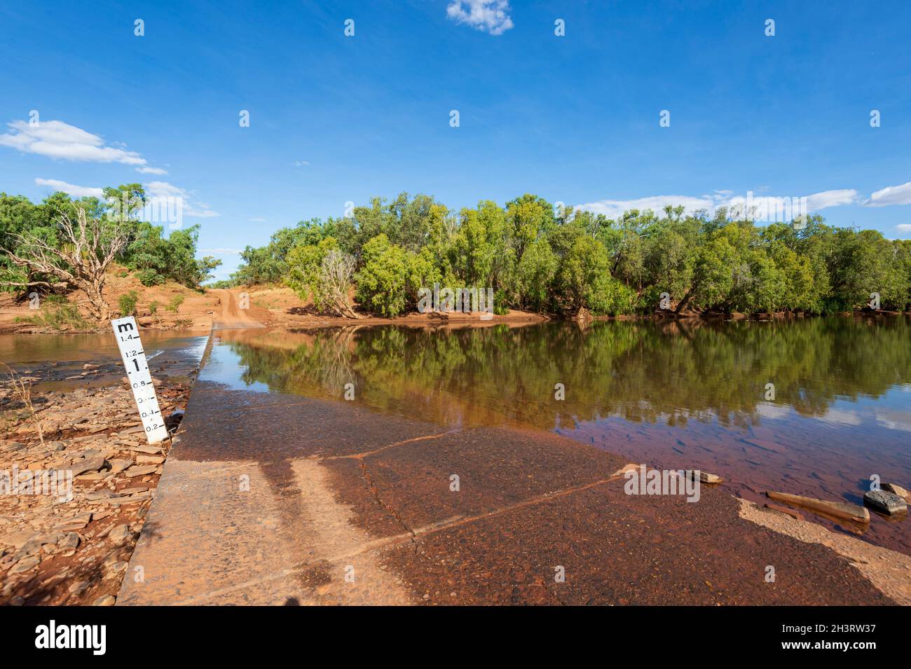 Flooded creek crossing on the remote Buchanan Highway, named after the ...