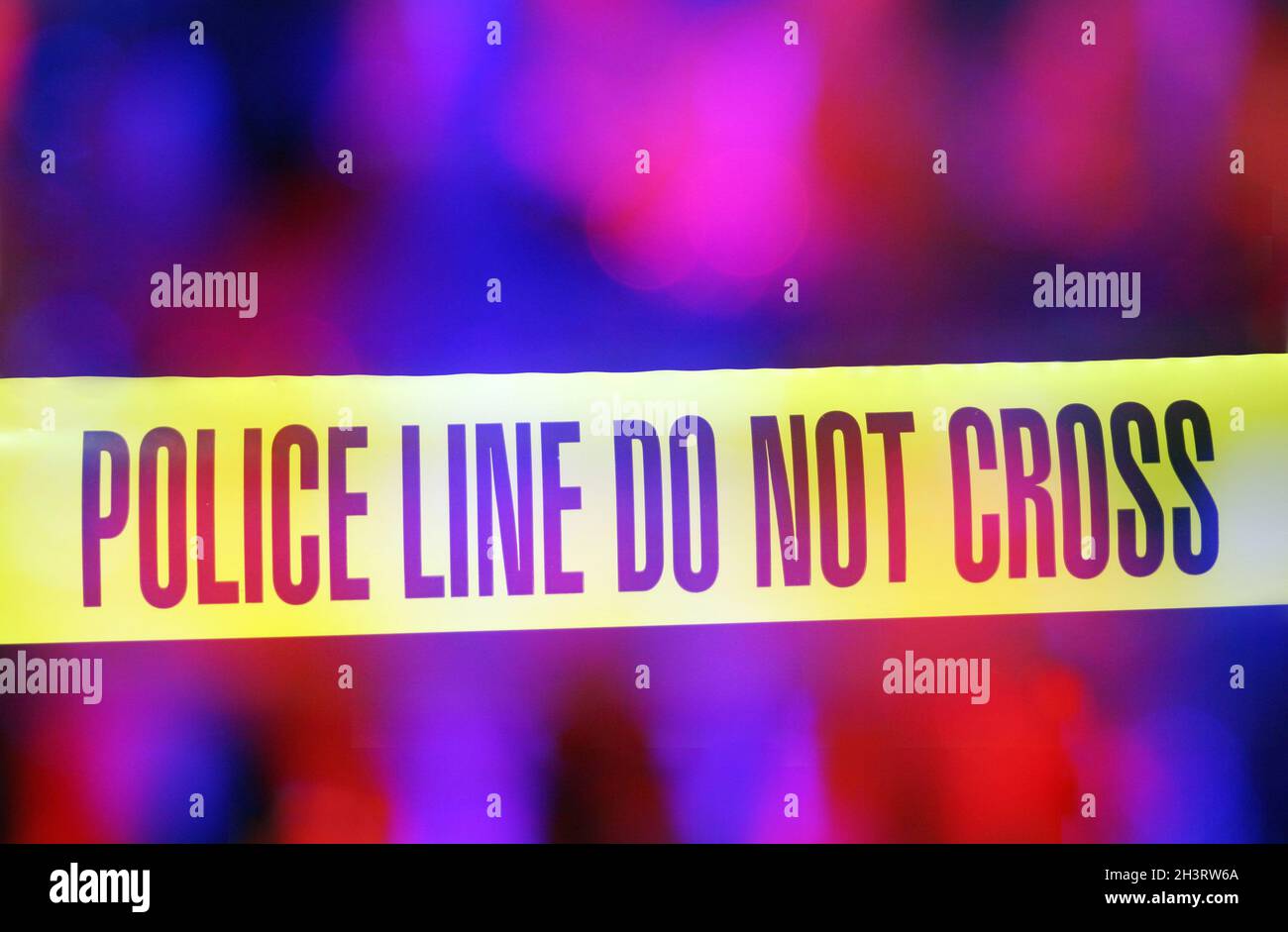 Police Line Do Not Cross Sign with red and blue lights Stock Photo - Alamy