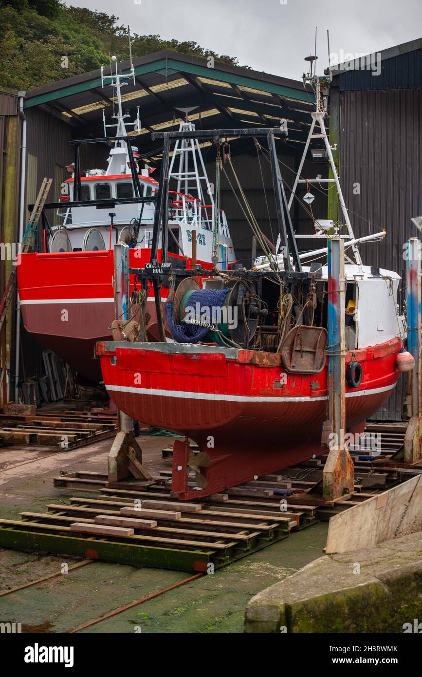 Fishing boats being refitted in a small boatyard in Eyemouth a small ...