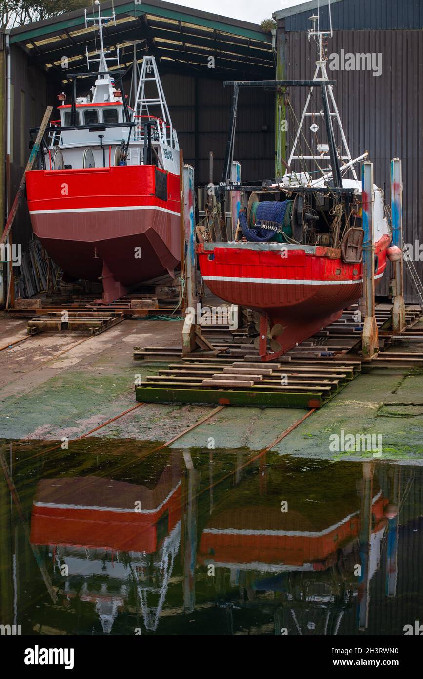 Fishing boats being refitted in a small boatyard in Eyemouth a small ...