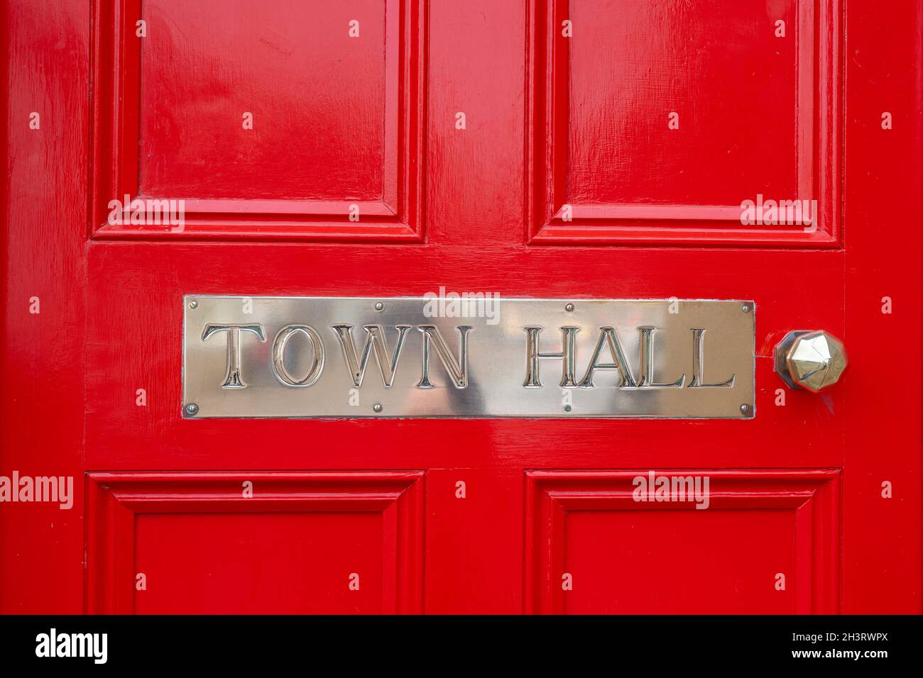 Town Hall silver metal sign. Polished chrome steel sign on bright red ...