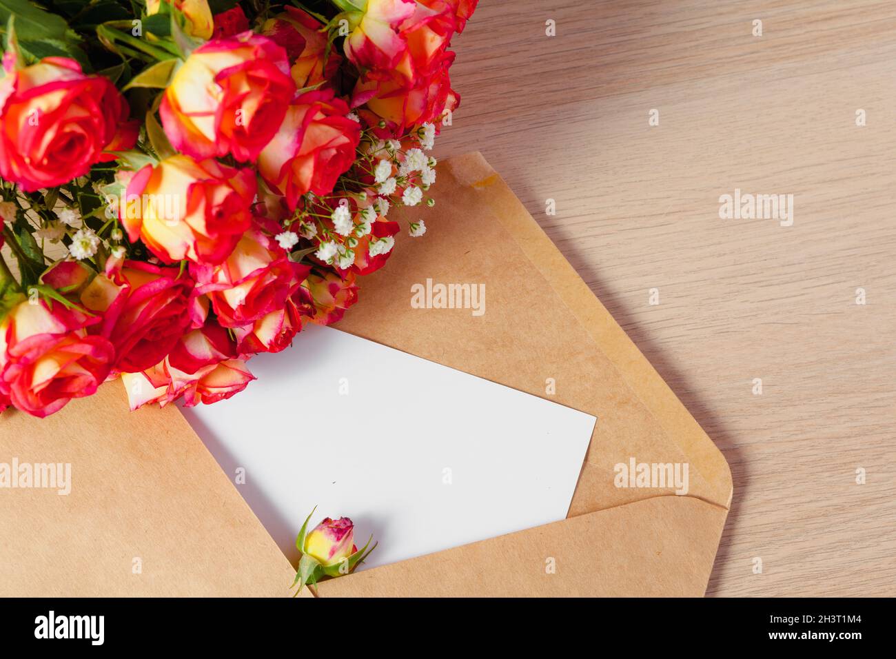 Craft paper envelope with bunch of flowers Stock Photo - Alamy