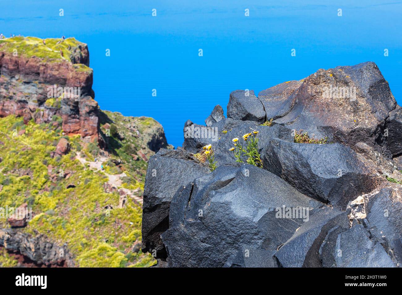 Santorini volcanic stone rock and caldera, Greece Stock Photo - Alamy