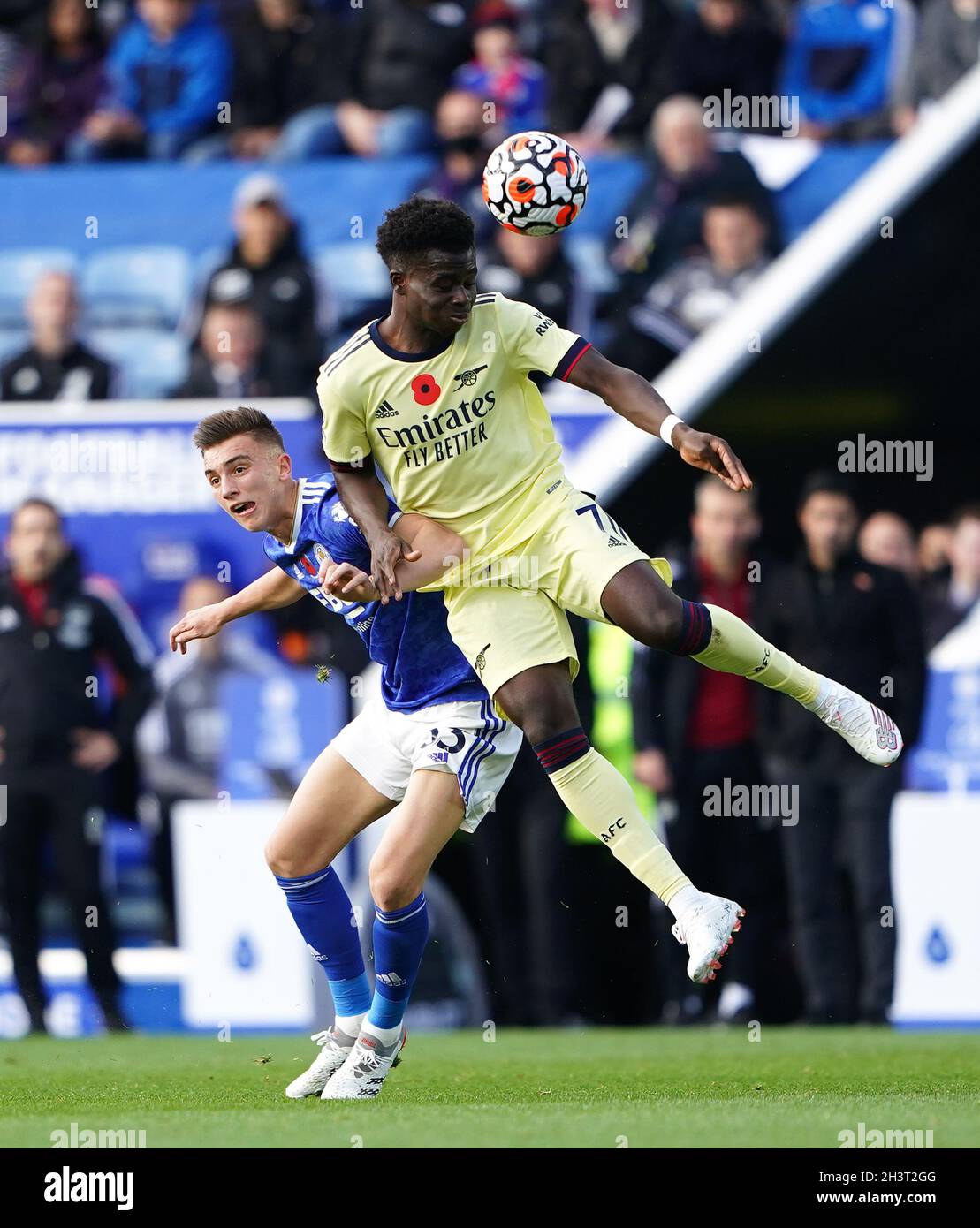 Leicester City's Luke Thomas (left) and Arsenal's Bukayo Saka battle ...