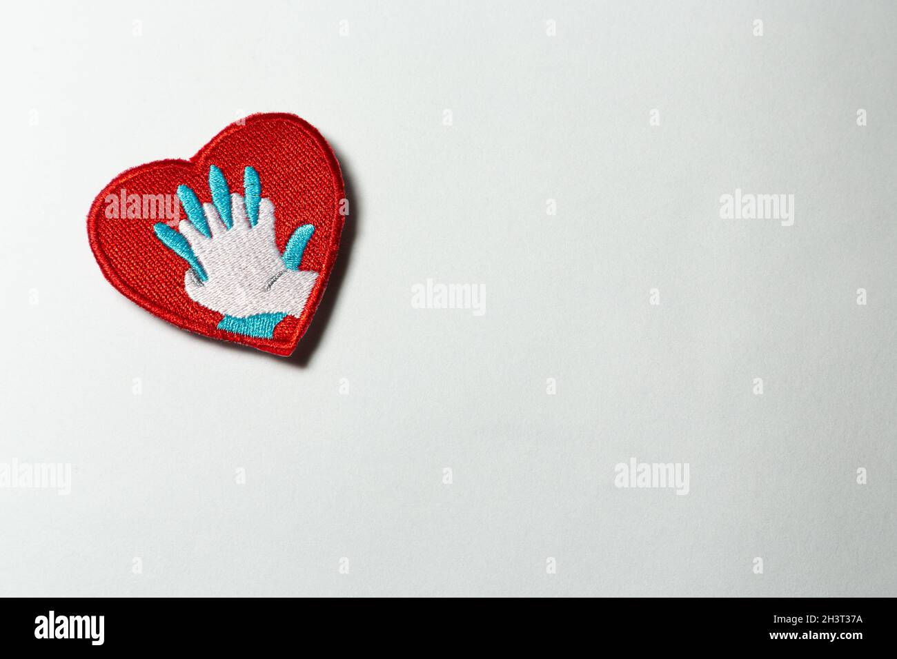 Heart shaped badge with CPR icon isolated on a white background with ...