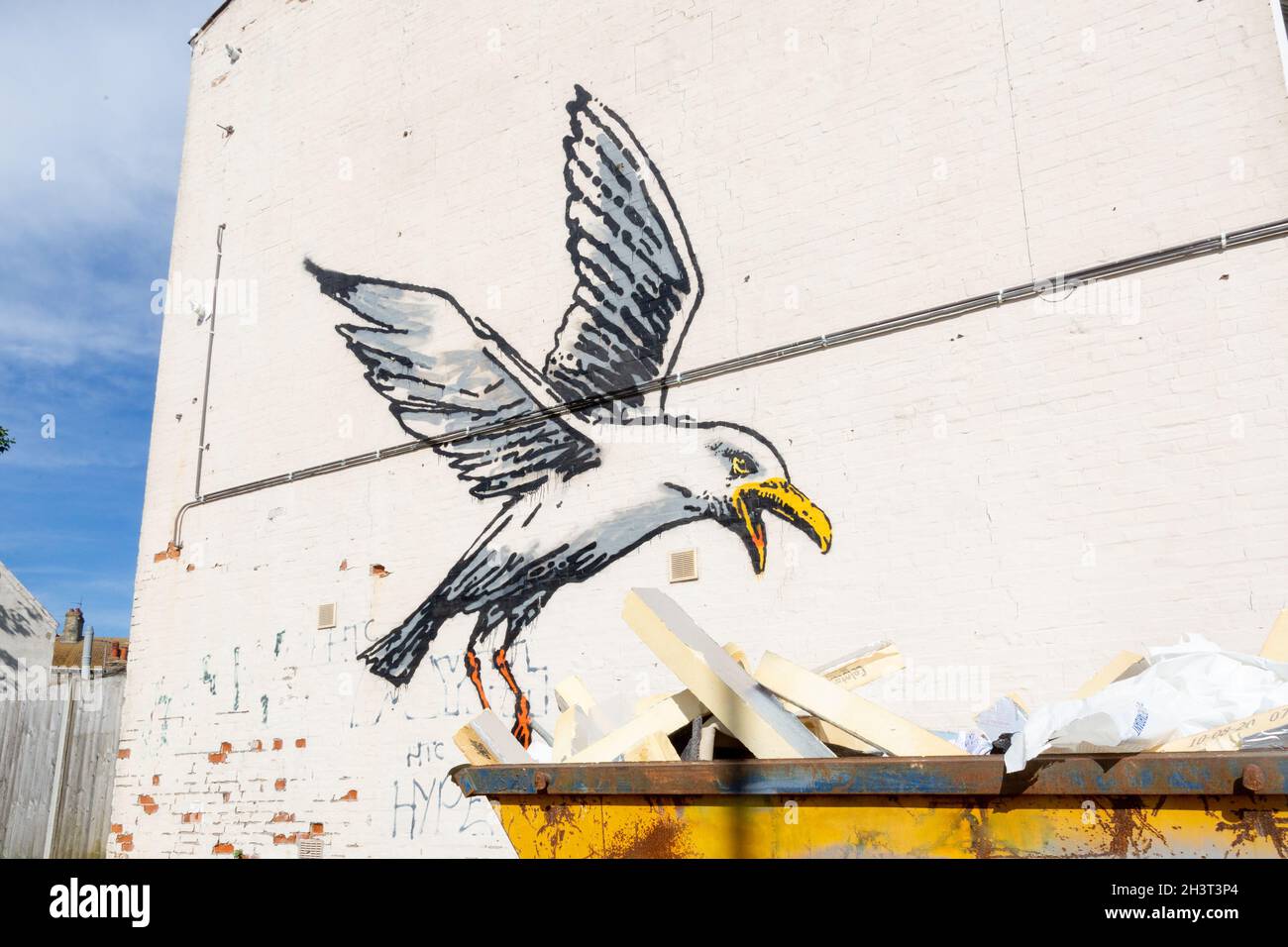 Herring Gull eating chips mural by Banksy on Trafalgar Street in ...
