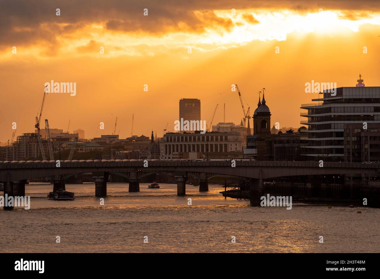 Sunset on the River Thames, looking towards London Bridge from Tower ...