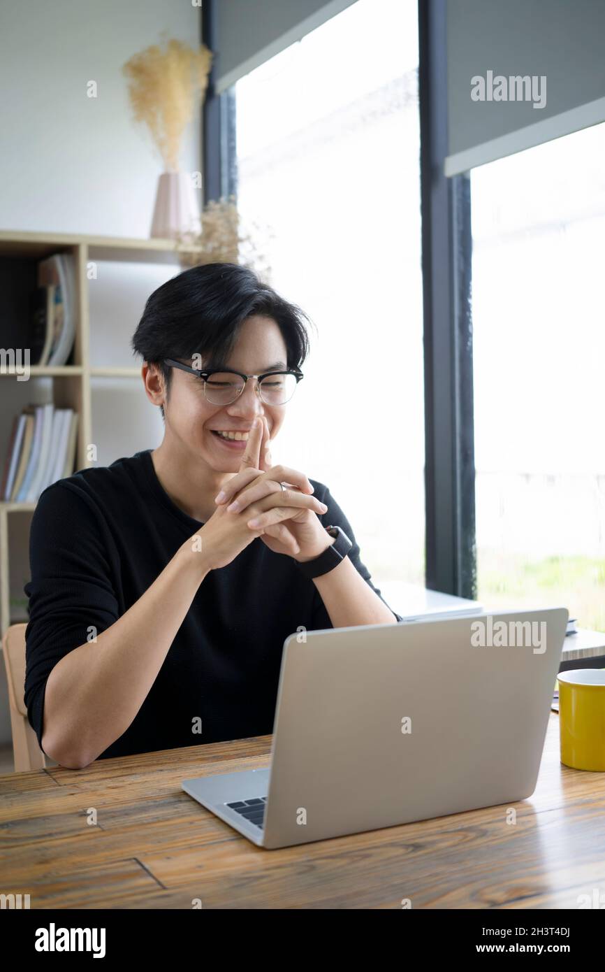 Asian businessman video conferencing hi-res stock photography and ...