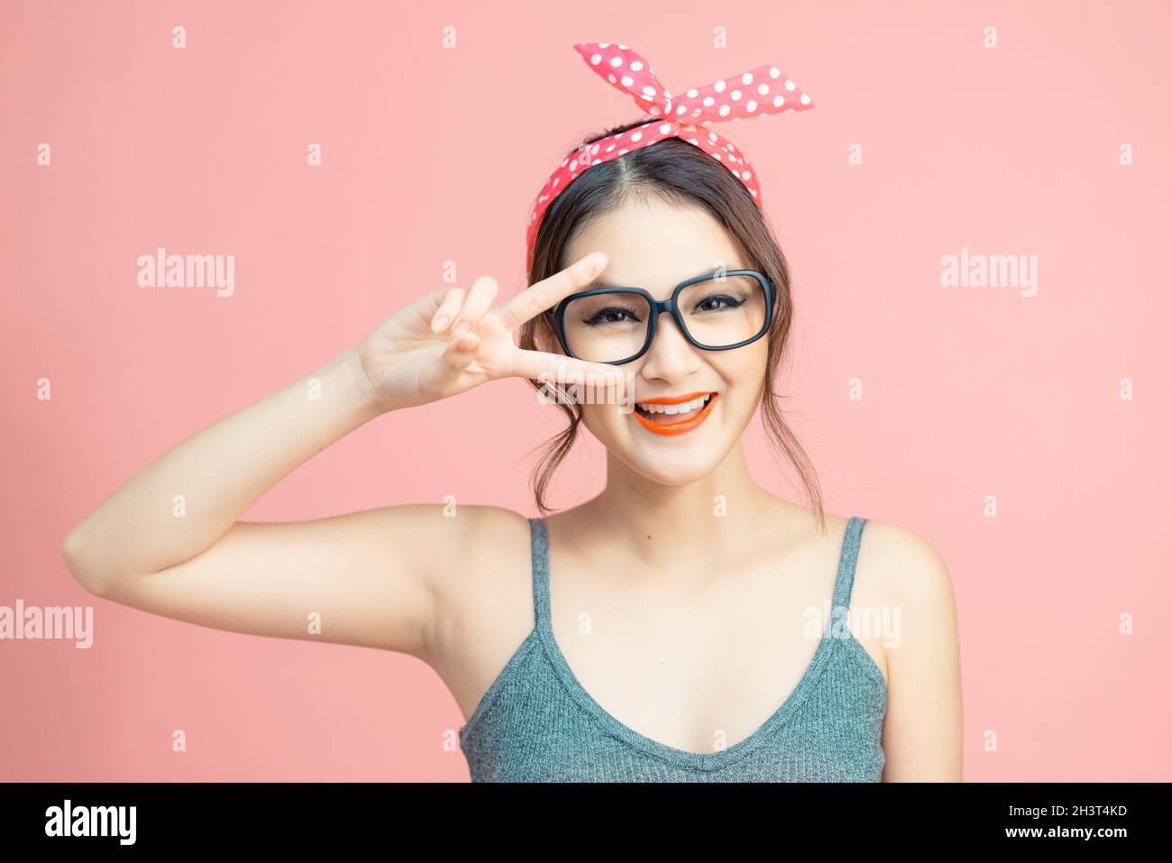 Attractive Lady Making V Sign Near Eyes Isolated On Pink Background
