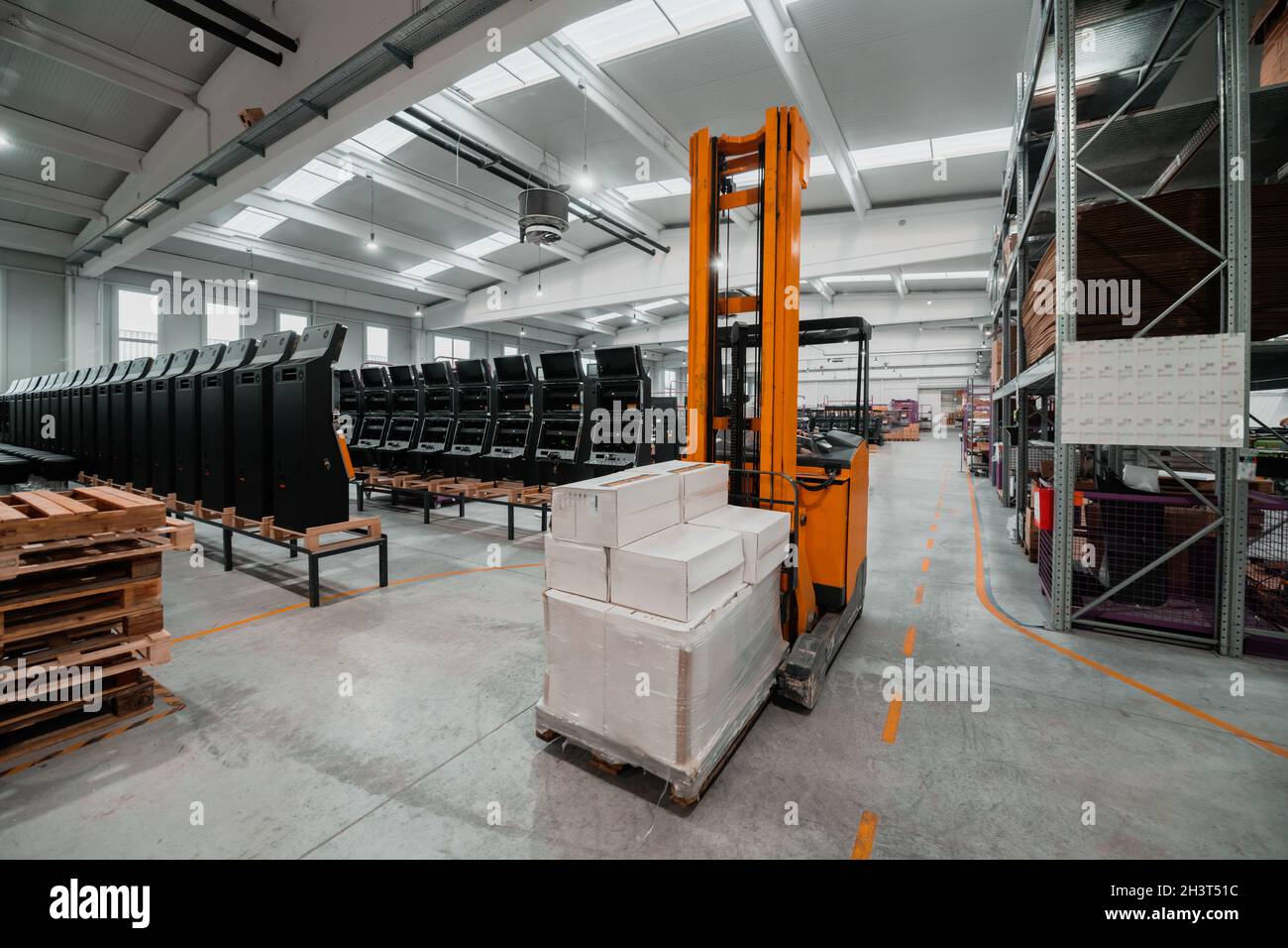 Forklift loader in storage warehouse ship yard. Distribution products ...