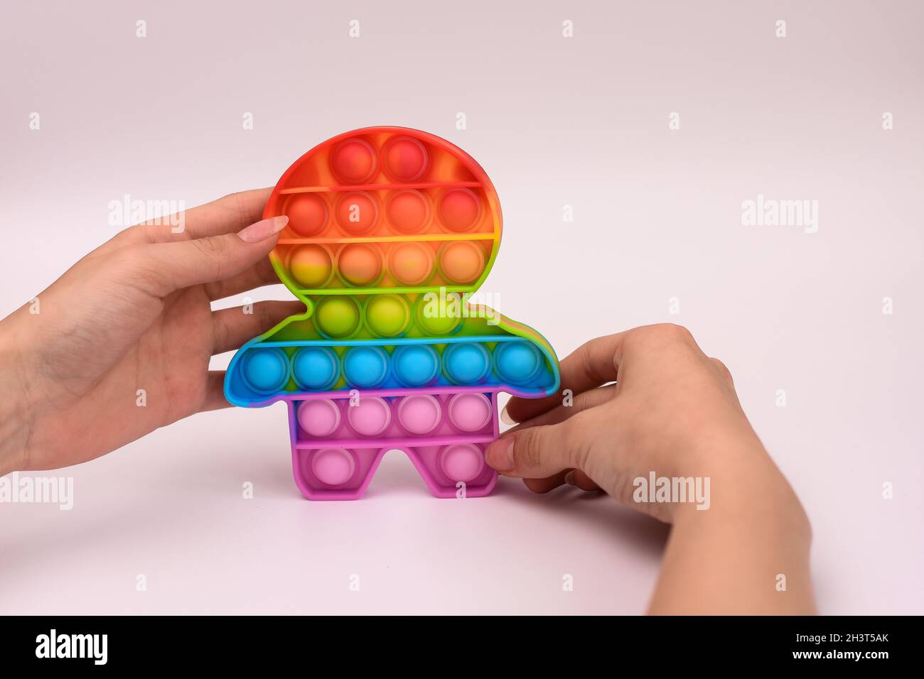 Touch silicone rubber pop it on white background Stock Photo - Alamy
