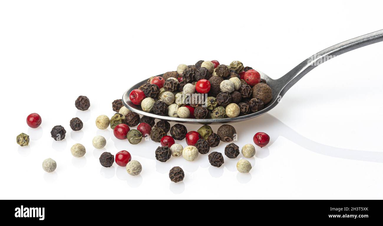 Pepper mix in spoon isolated on white background Stock Photo - Alamy