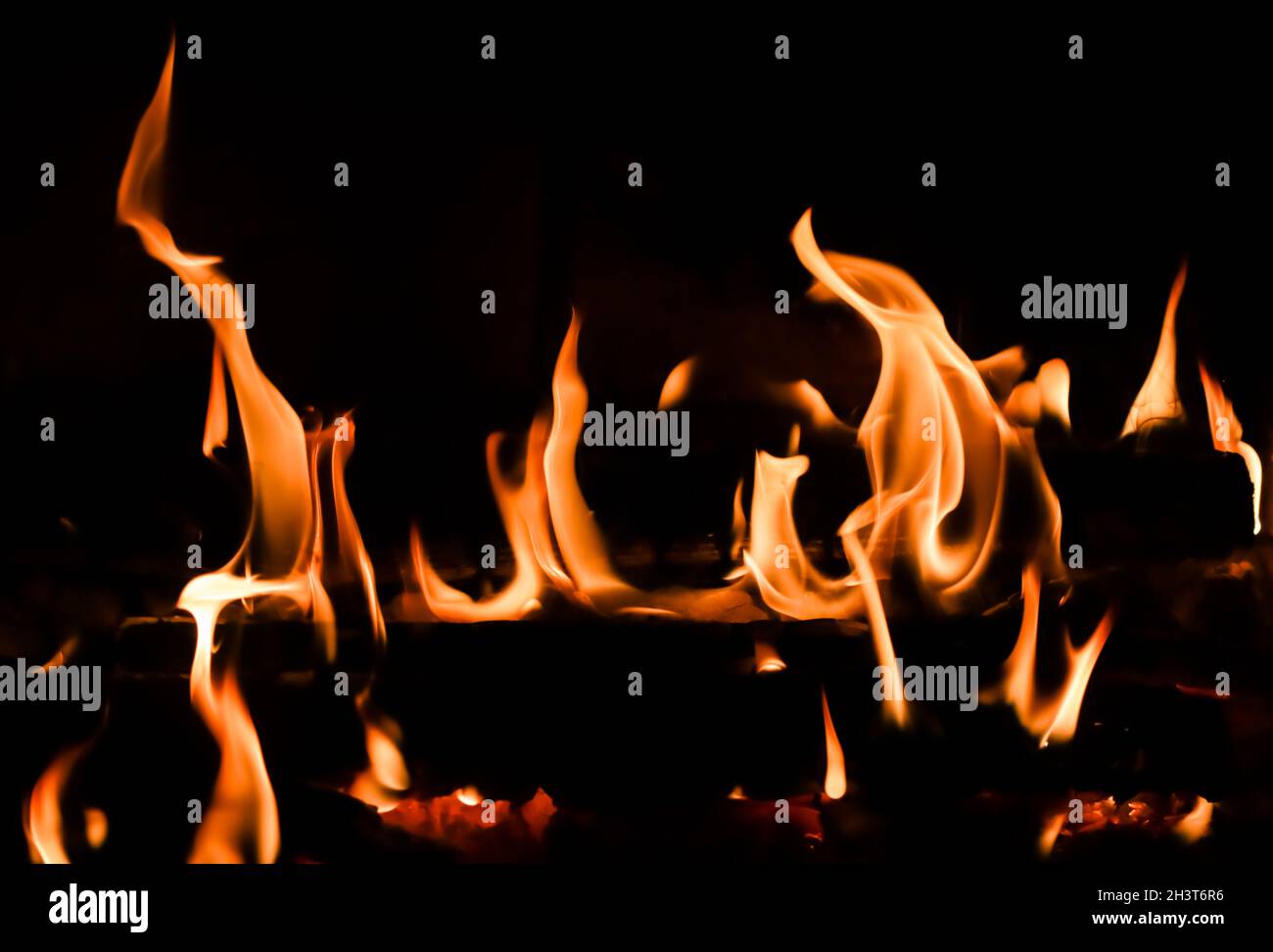 Red blaze Fire flame on a black background Stock Photo - Alamy