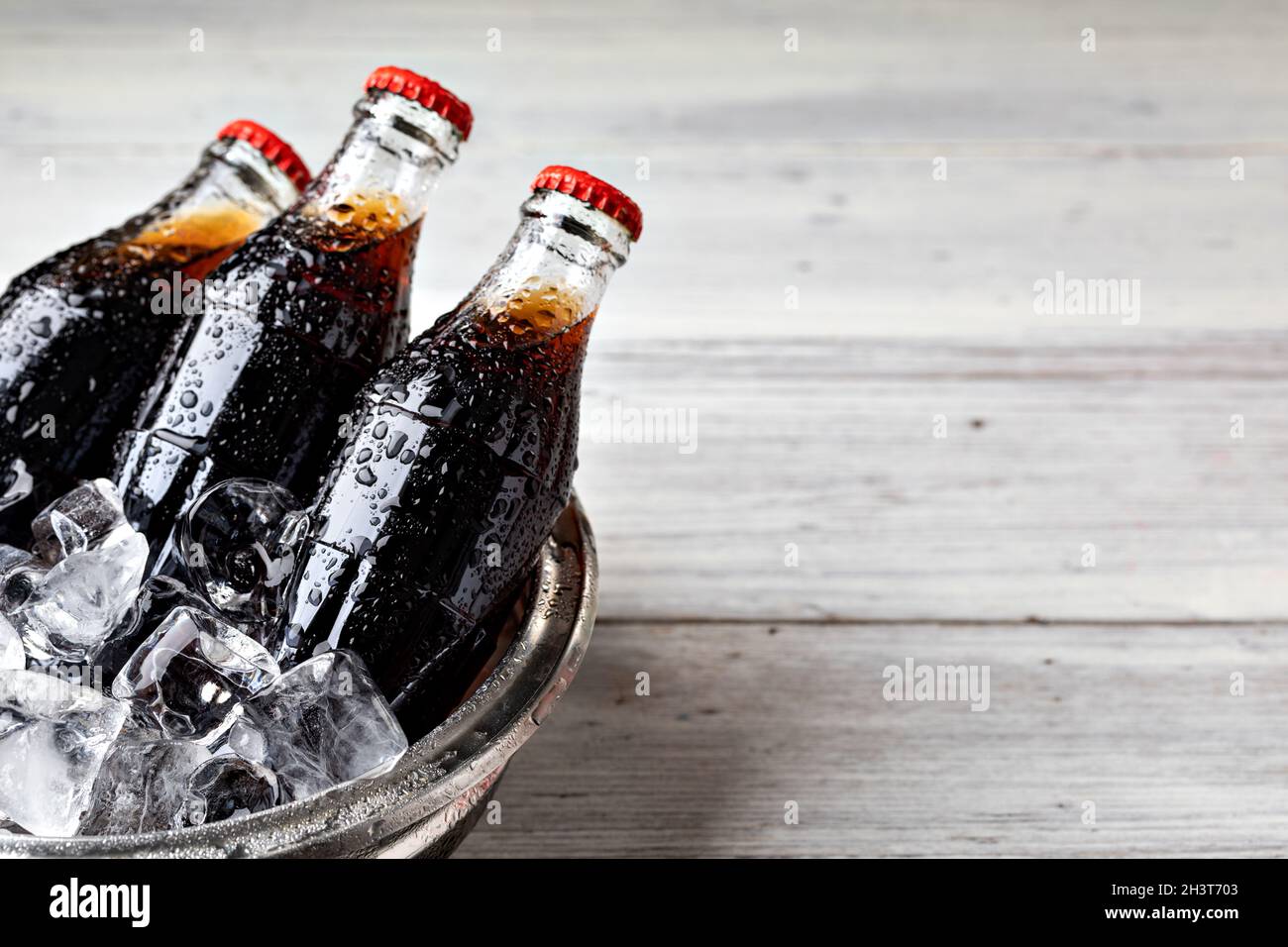 Soda Bottle on Bed of Ice Stock Photo - Alamy