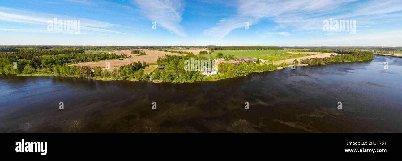 Aerial panoramic view of river Kymijoki bank with beautiful wooden ...