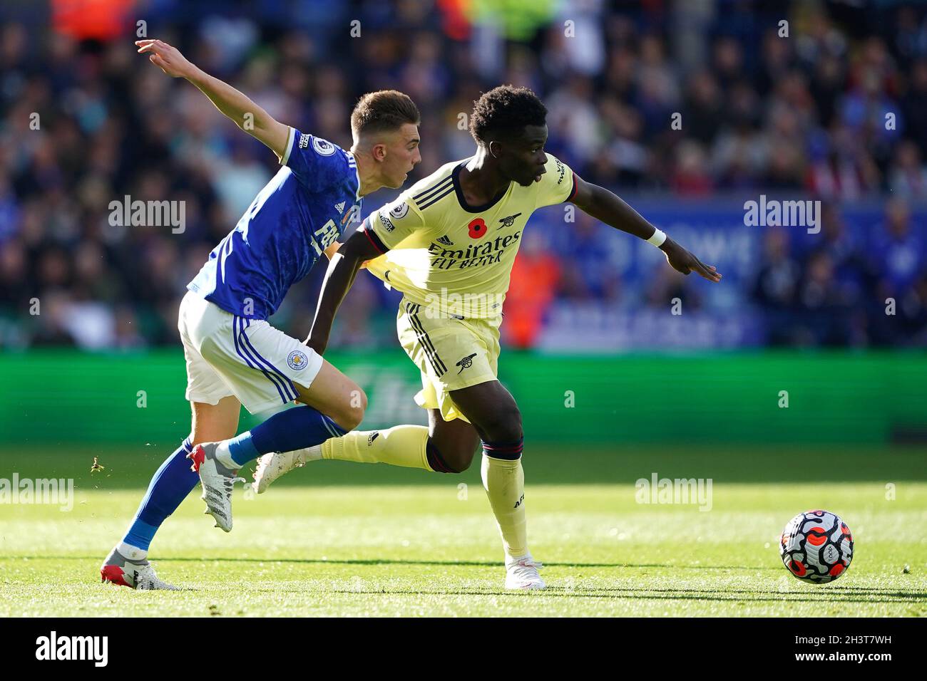 Leicester City's Luke Thomas (left) and Arsenal's Bukayo Saka battle ...